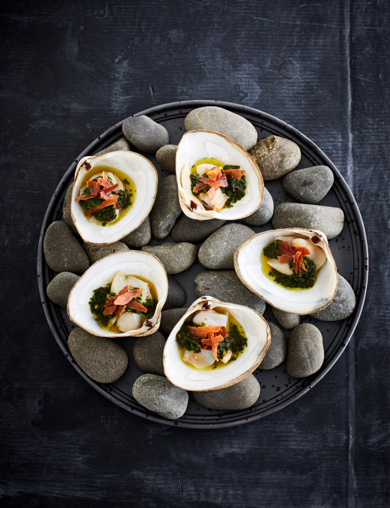 Steamed Cloudy Bay clams, crispy ham, chimichurri